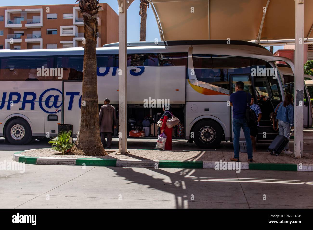 Marrakech, Morocco - August 28, 2023 People traveling in a Supratours ...