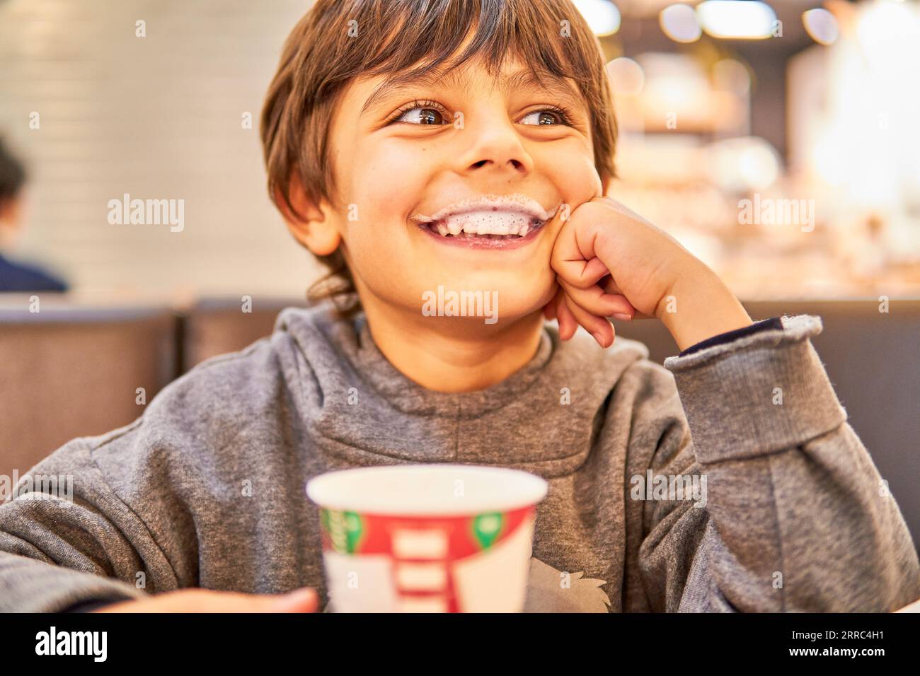 Happy boy drinking vegetable drink with milk moustache Stock Photo - Alamy