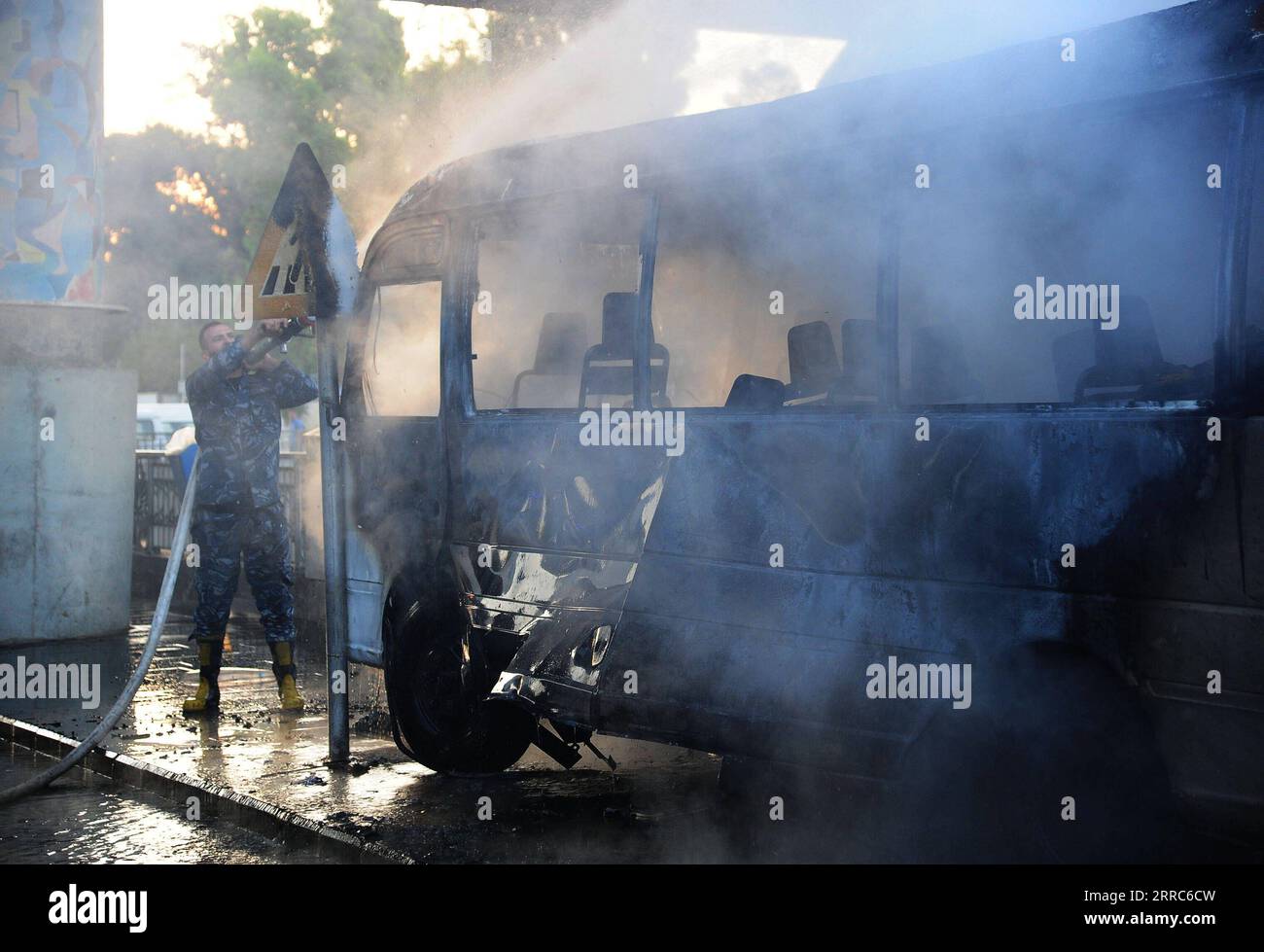 211020 -- DAMASCUS, Oct. 20, 2021 -- A firefighter puts out the fire on ...