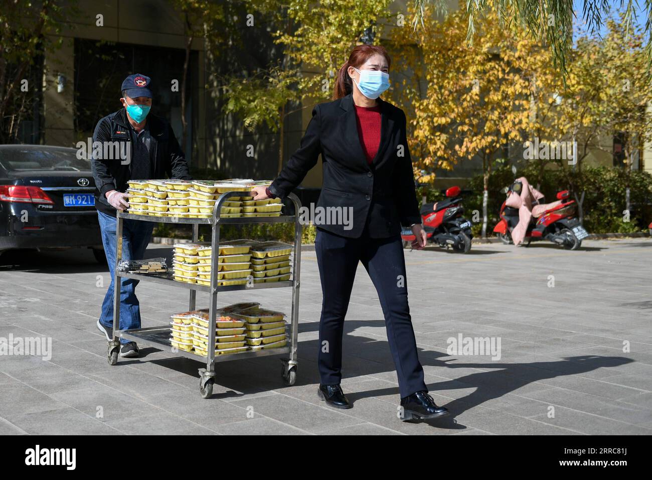 211023 -- EJINA BANNER, Oct. 23, 2021 -- Employees of a hotel canteen ...