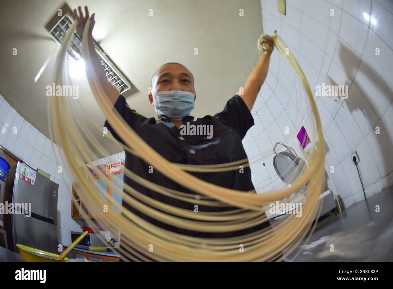 211023 -- ADDIS ABABA, Oct. 23, 2021 -- Chef Yang Yi works in the ...