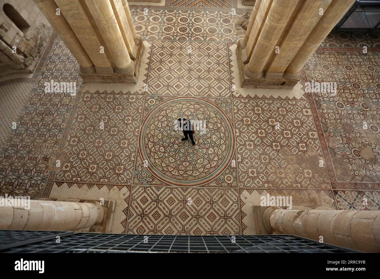 211028 -- JERICHO, Oct. 28, 2021 -- A Palestinian worker stands on ...
