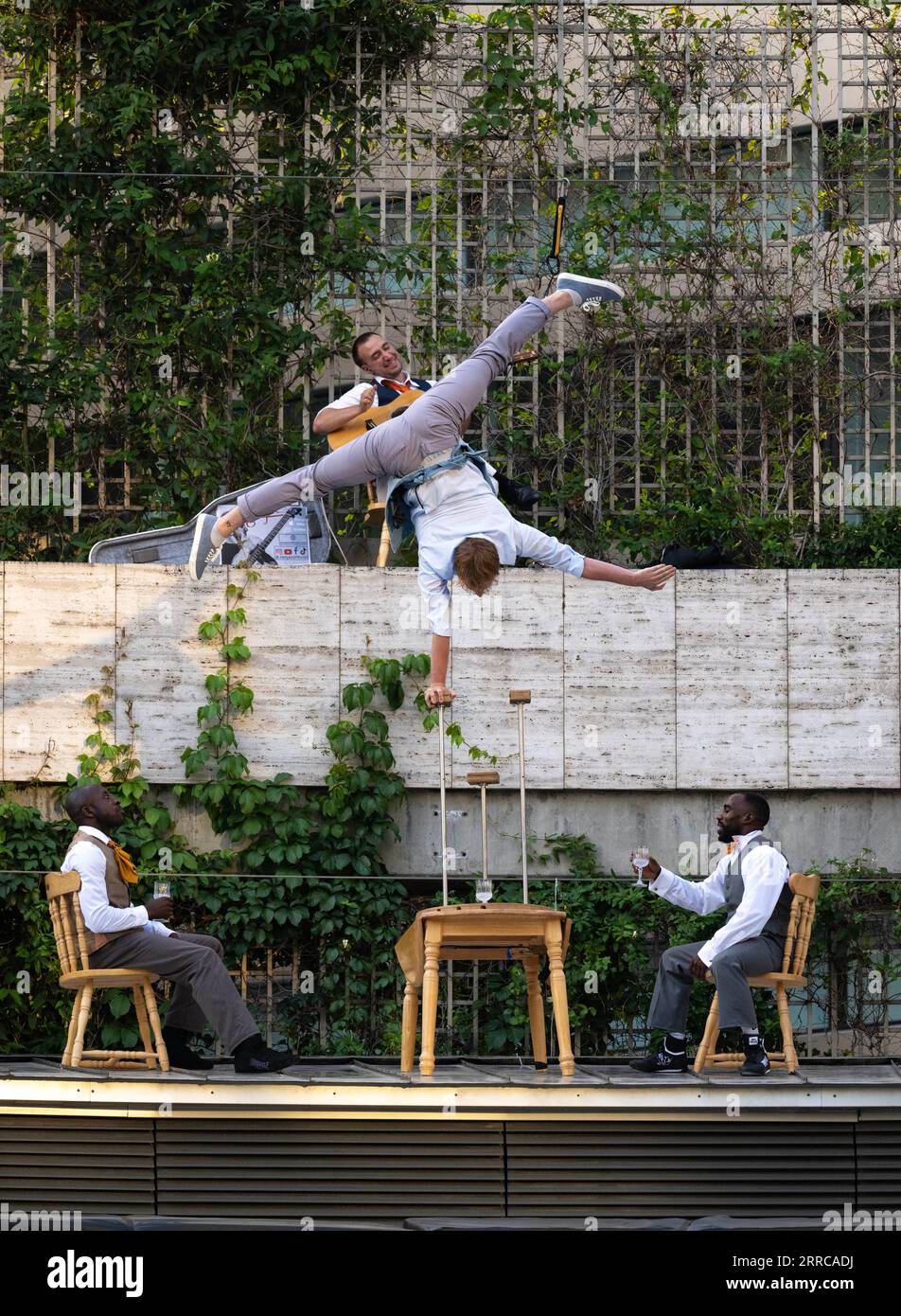 EDITORIAL USE ONLY Performers take part in Dinner for All, an immersive ...
