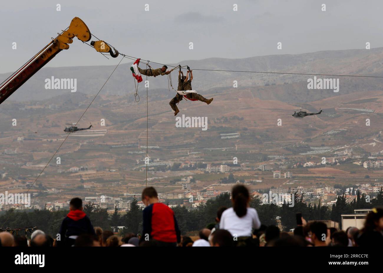 211031 -- BEKAA LEBANON, Oct. 31, 2021 -- People watch military ...
