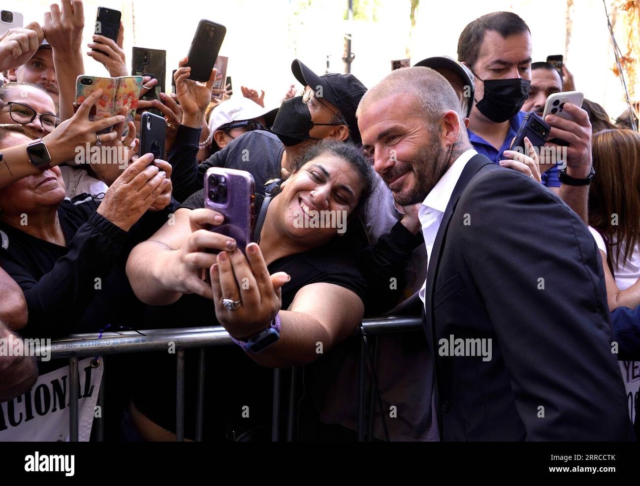David Beckham poses with fans during a ceremony honoring Marc Anthony ...