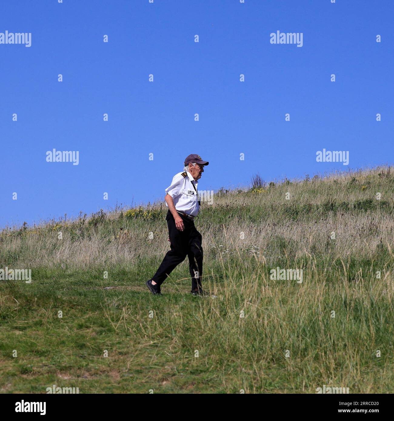 Maritime Operations Officer - Mature Coastguard in uniform on the path ...