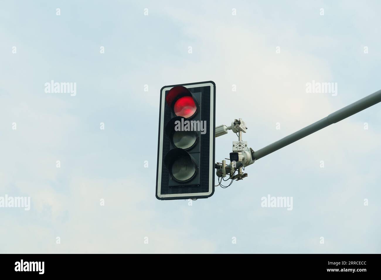 View of a traffic light and a traffic camera that captures the passage ...