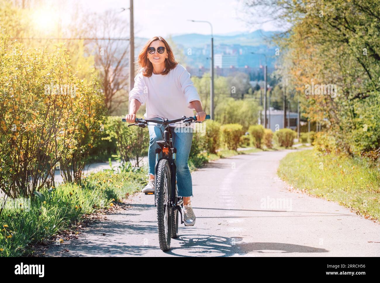Girl riding on her new bicycle hi-res stock photography and images - Alamy