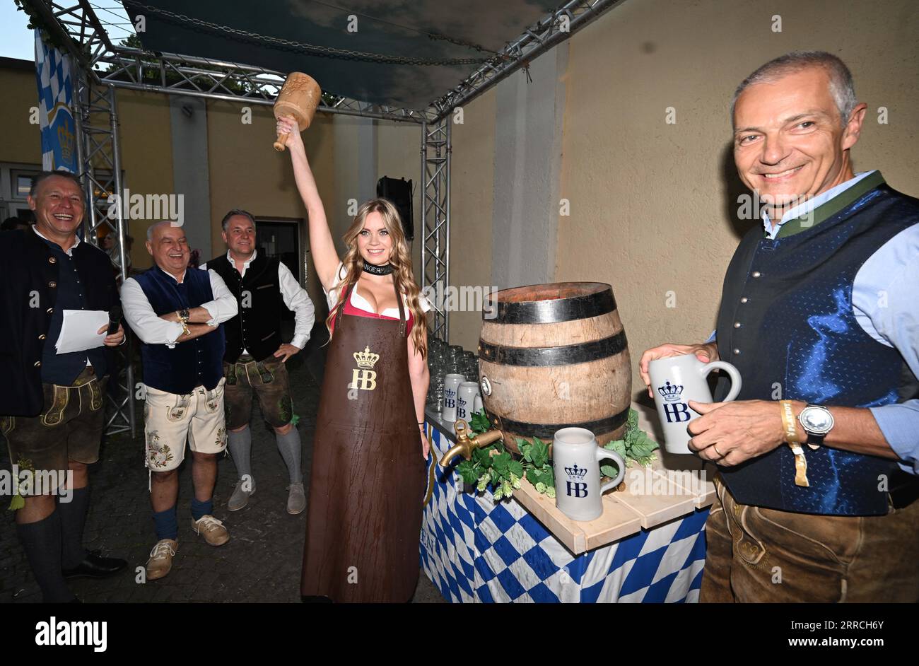 Munich, Germany. 07th Sep, 2023. Wiesn Playmate Laura Langas (l) taps a ...
