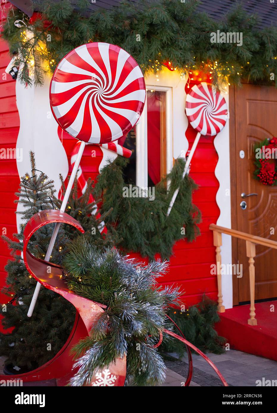 Red large Christmas candy canes on the background of a red Christmas ...