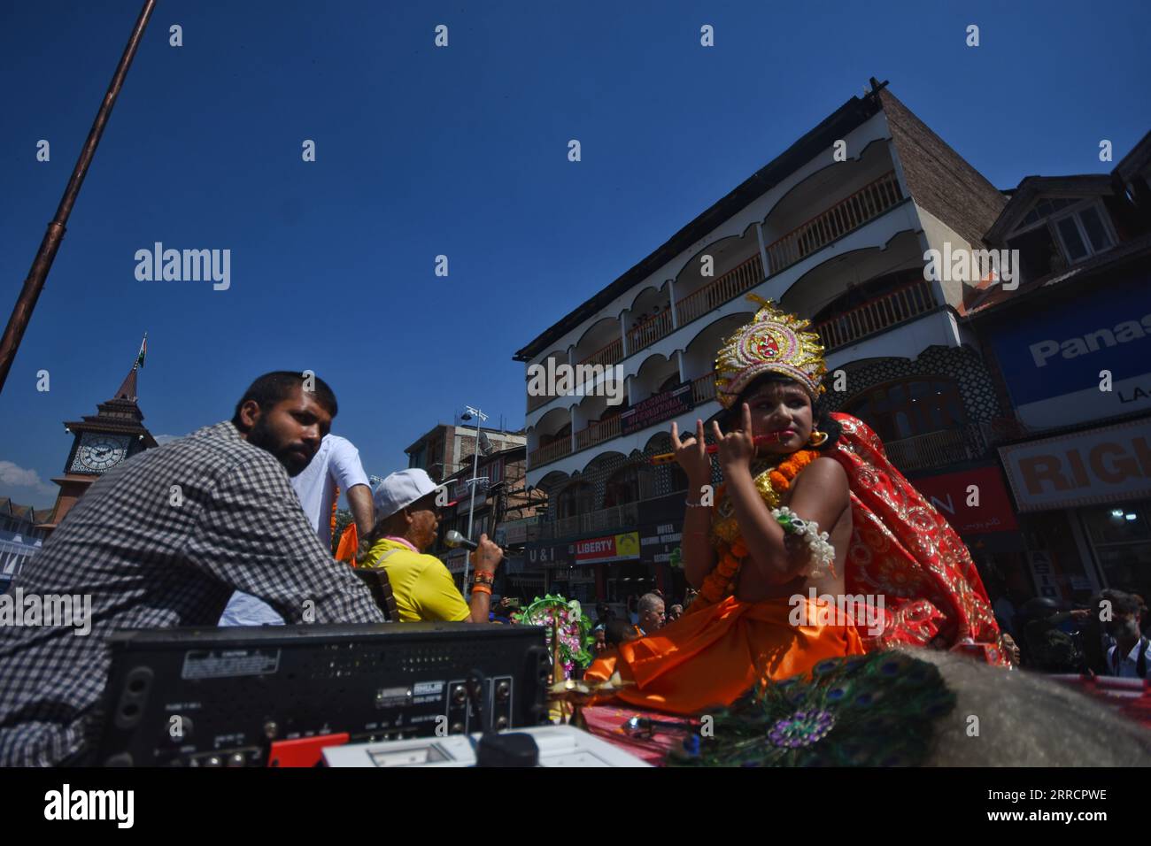 A young Hindu boy and girl, dressed as Lord Krishna and Radha, take part in the Hindu religious ...