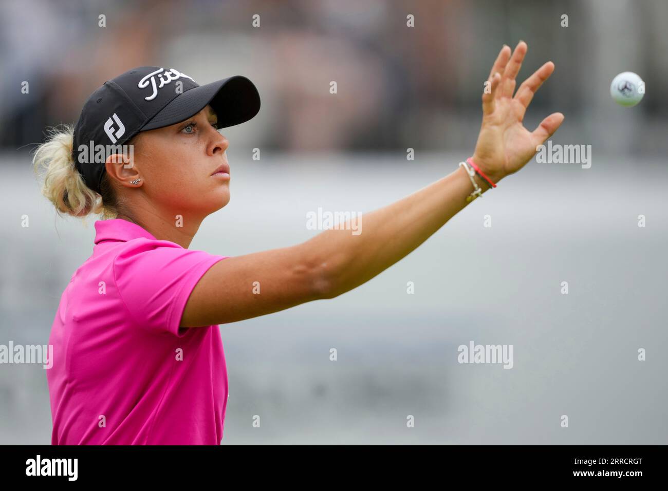 Pauline Roussin-Bouchard, of France, catches her golf ball as she ...