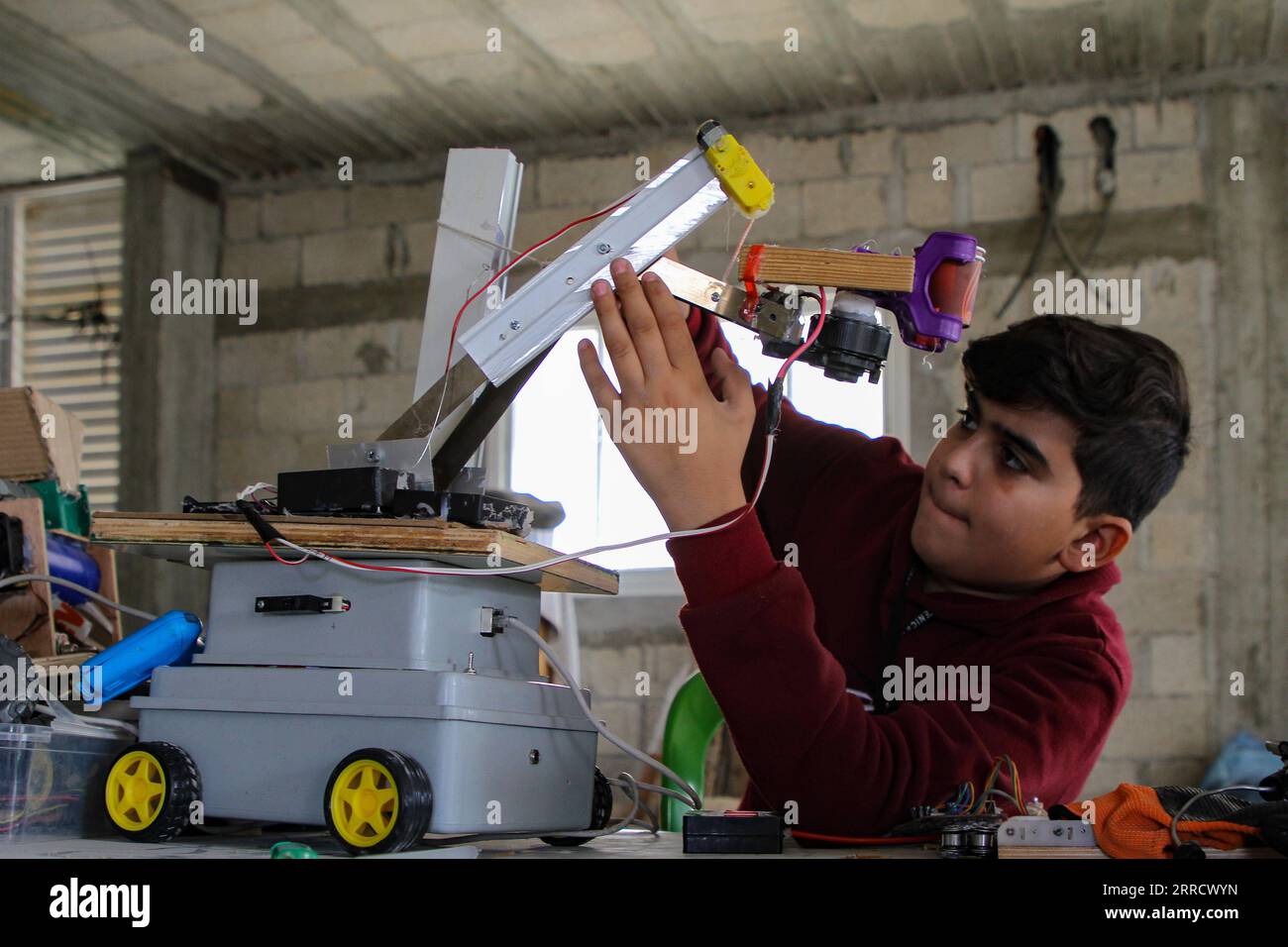 211120 -- GAZA, Nov. 20, 2021 -- Palestinian Mohammed al-Halaq works on ...