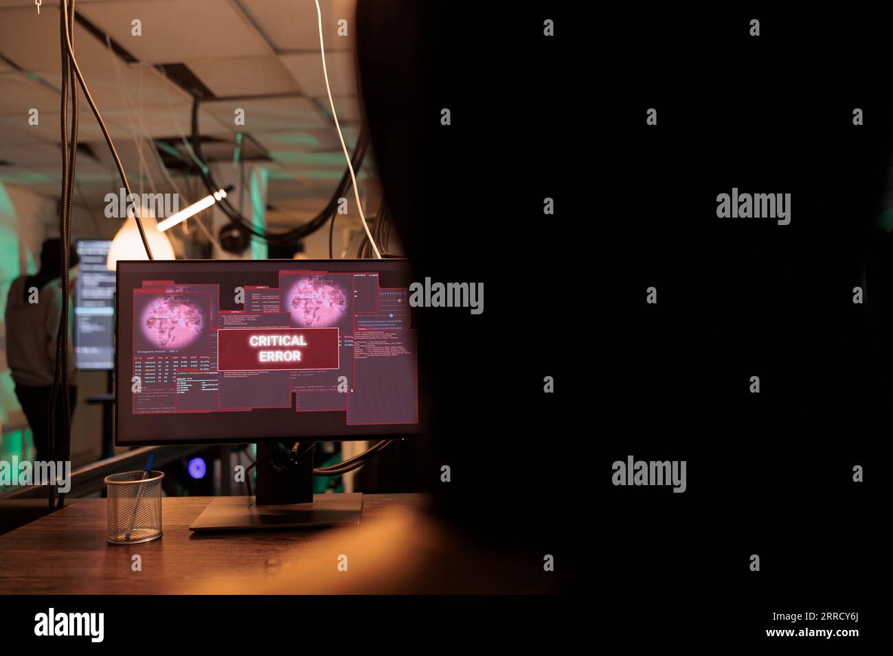 Male thief reading computer system hacking error message, hacker stealing database information ...