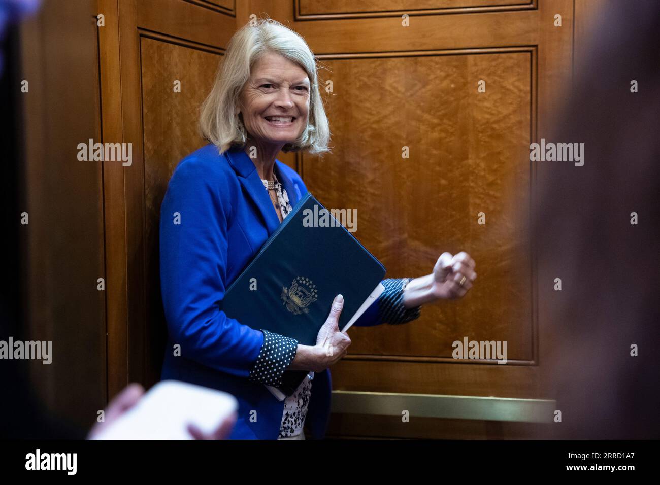 Sen. Lisa Murkowski (R-Alaska) speaks with reporters as she boards an ...
