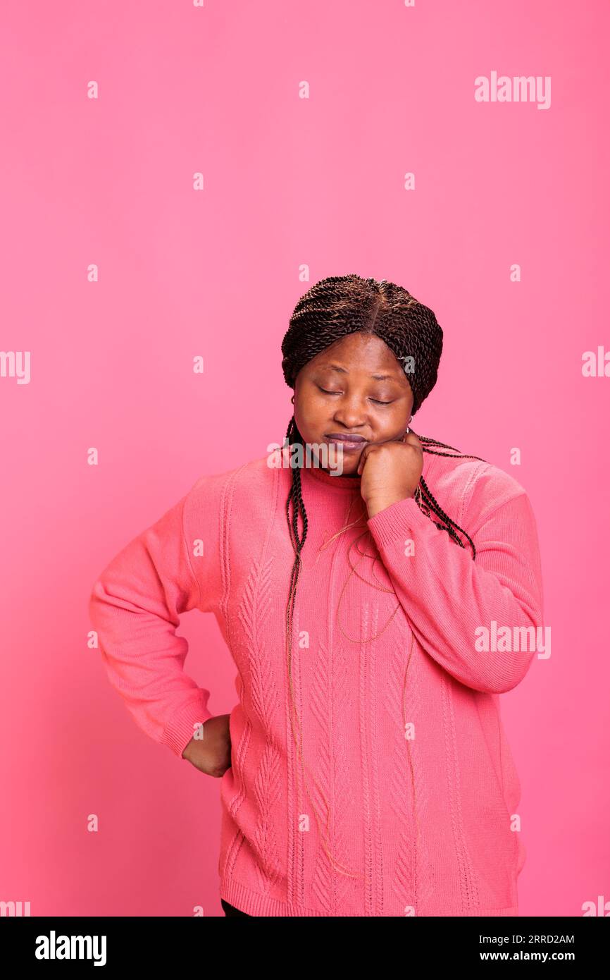 Portrait of injured woman having painful toothache while posing over ...