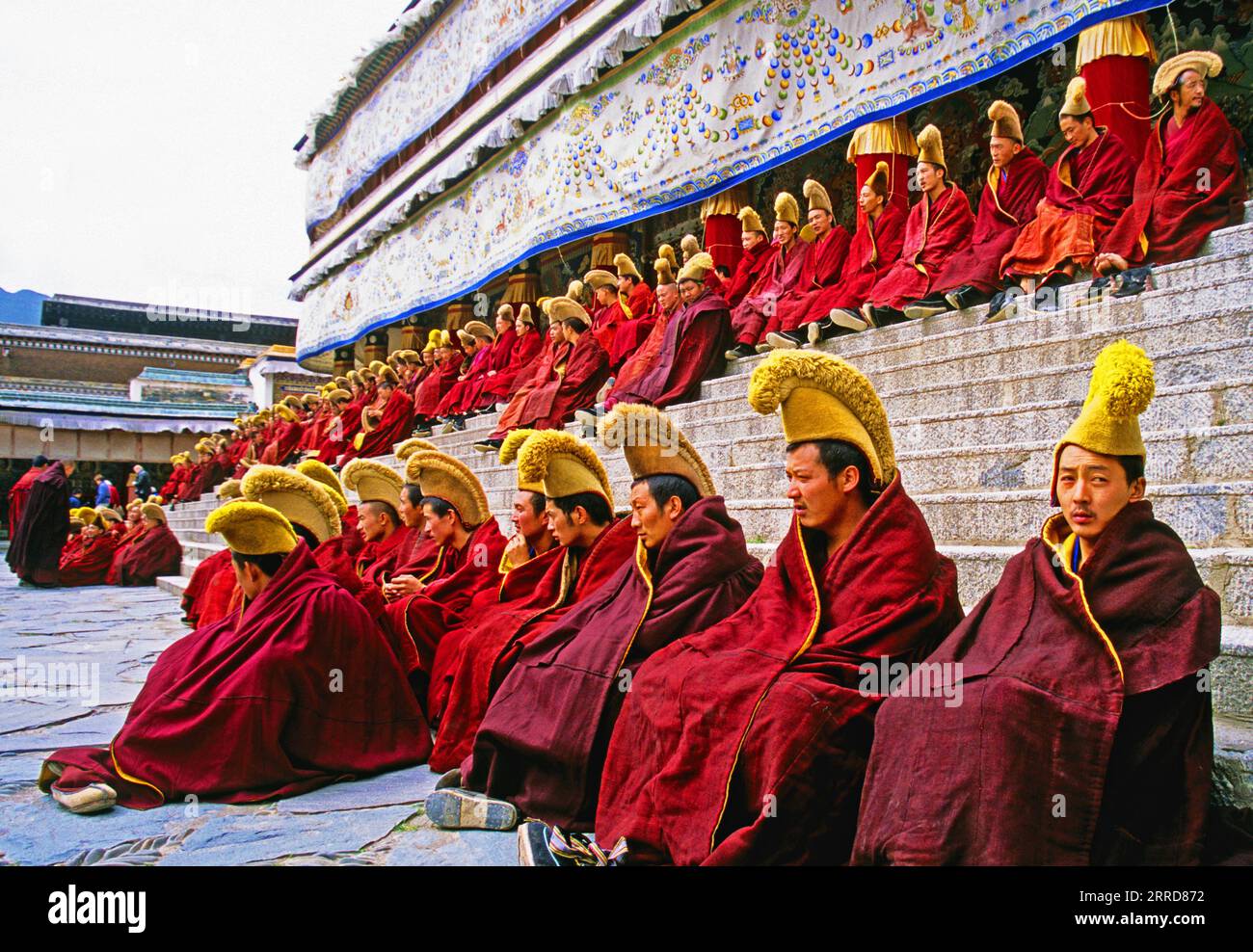 Tibetan monks of the Yellow Hat Sect on steps of Labrang monastery in ...