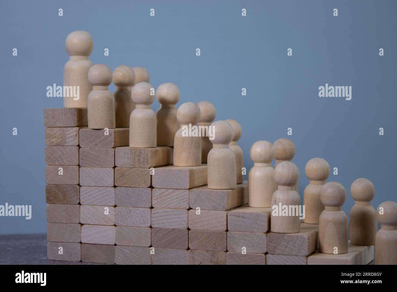 Stack of wooden cubes with red arrows going up. The process of ...