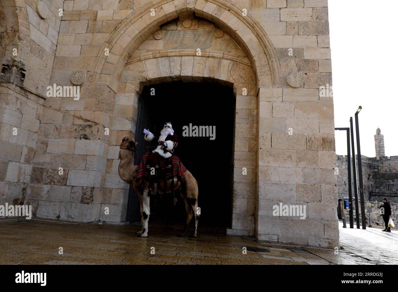 211223 -- JERUSALEM, Dec. 23, 2021 -- A man dressed as Santa Claus ...
