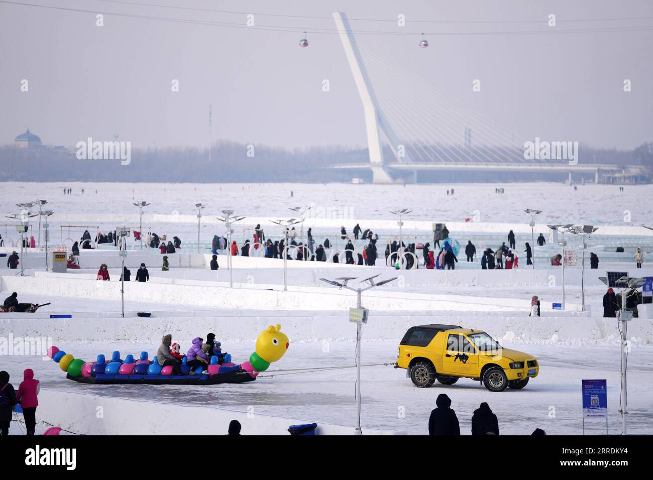 220101 -- HARBIN, Jan. 1, 2022 -- People play at a winter recreation ...