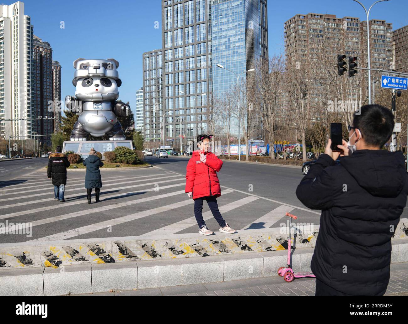 220102 -- BEIJING, Jan. 2, 2022 -- A girl poses for photos with a giant ...