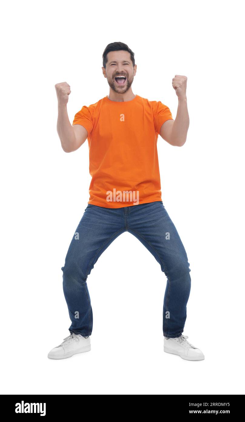 Emotional sports fan celebrating on white background Stock Photo - Alamy