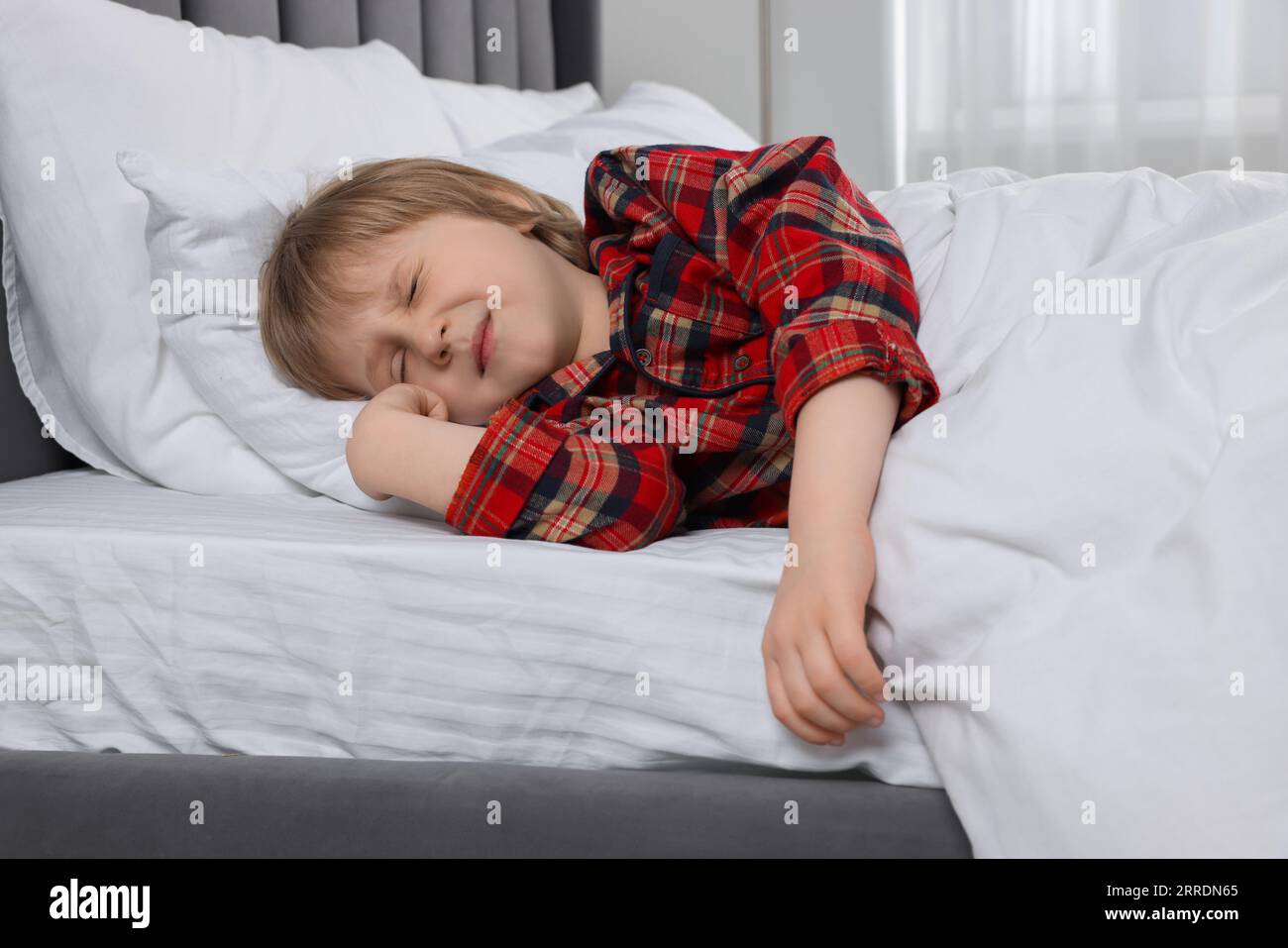Little boy snoring while sleeping in bed at home Stock Photo - Alamy