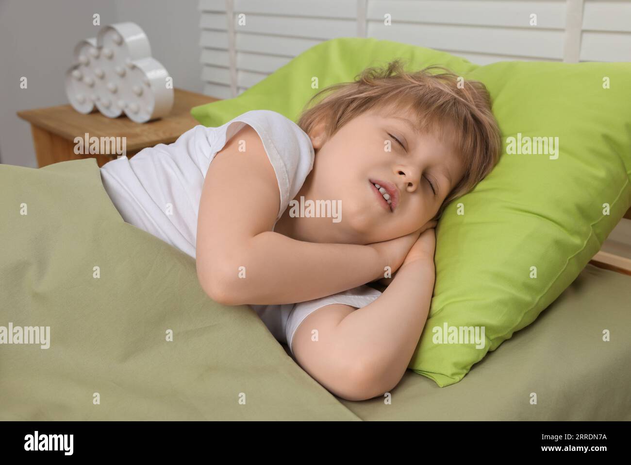 Little boy snoring while sleeping in bed indoors Stock Photo - Alamy