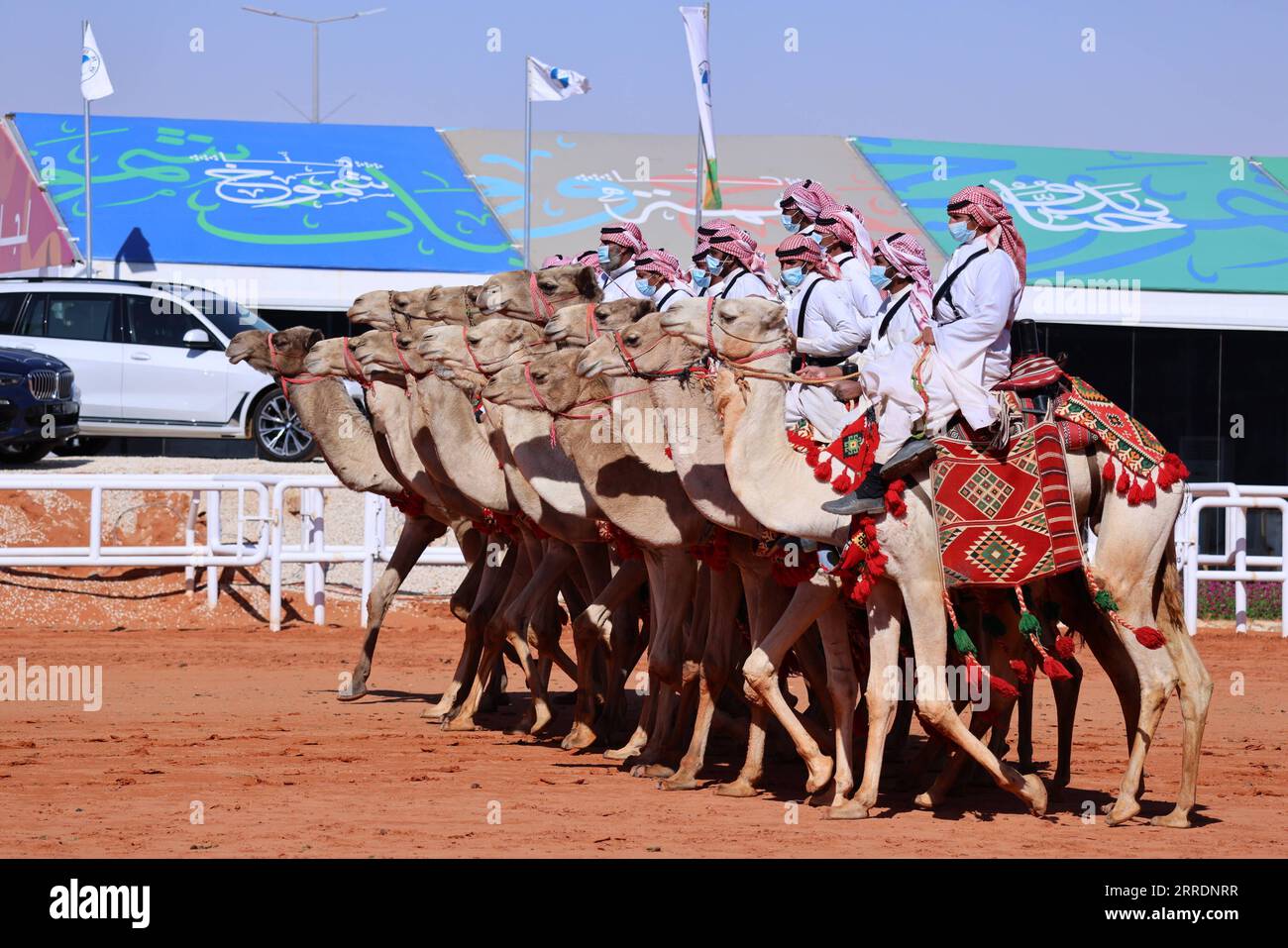 220105 -- RIYADH, Jan. 5, 2022 -- People ride camels for a parade ...