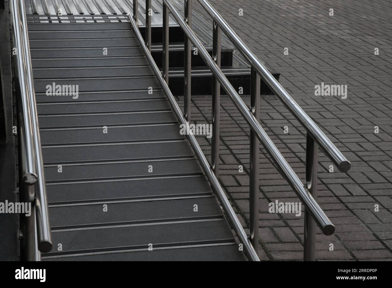 Ramp with metal railings near building outdoors Stock Photo - Alamy