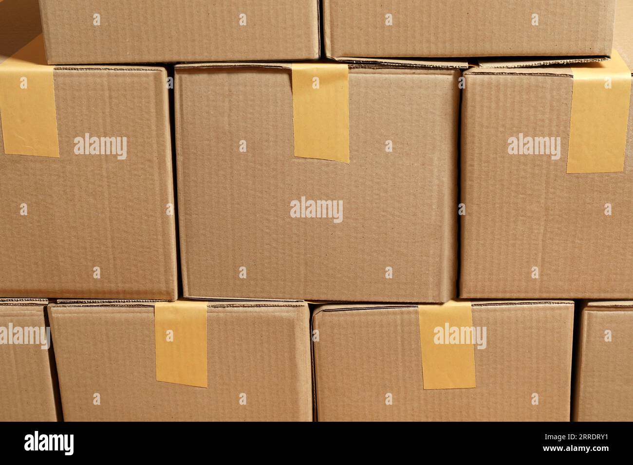 Stack of many cardboard boxes as background. Packaging goods Stock ...