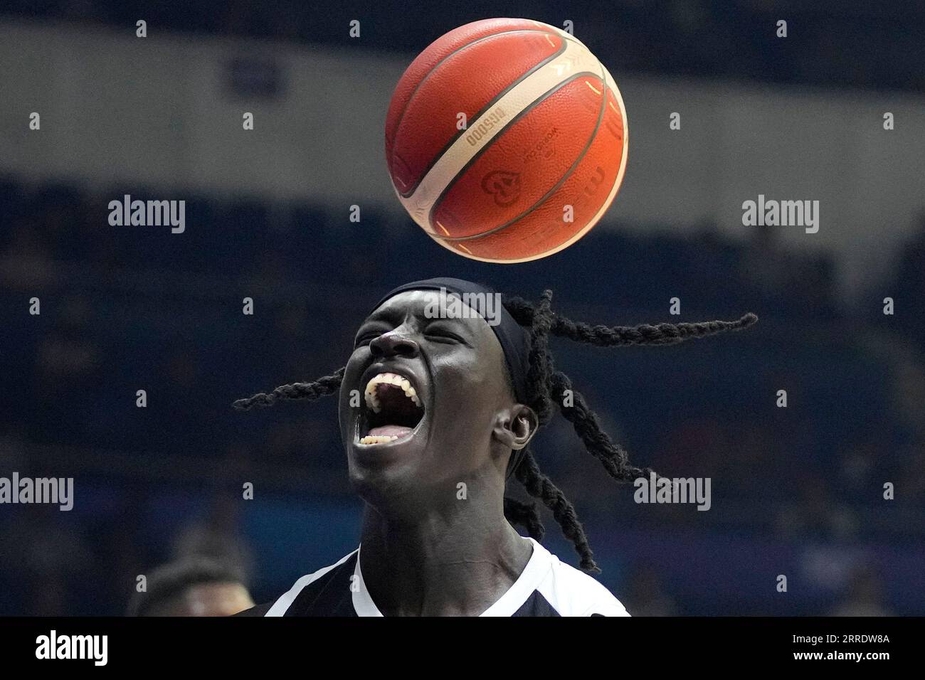 South Sudan center Deng Acuoth reacts after scoring against Angola ...
