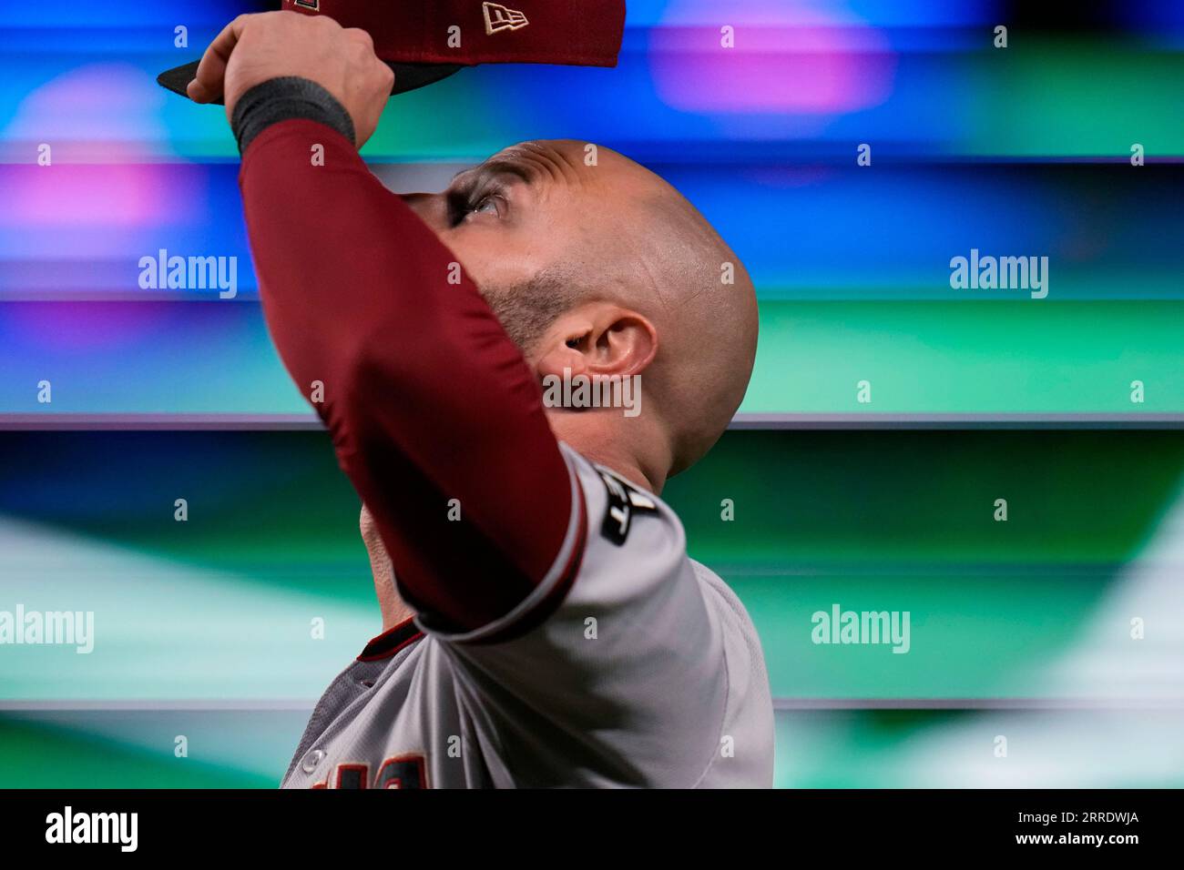 Arizona Diamondbacks first baseman Christian Walker dons his cap in the ...