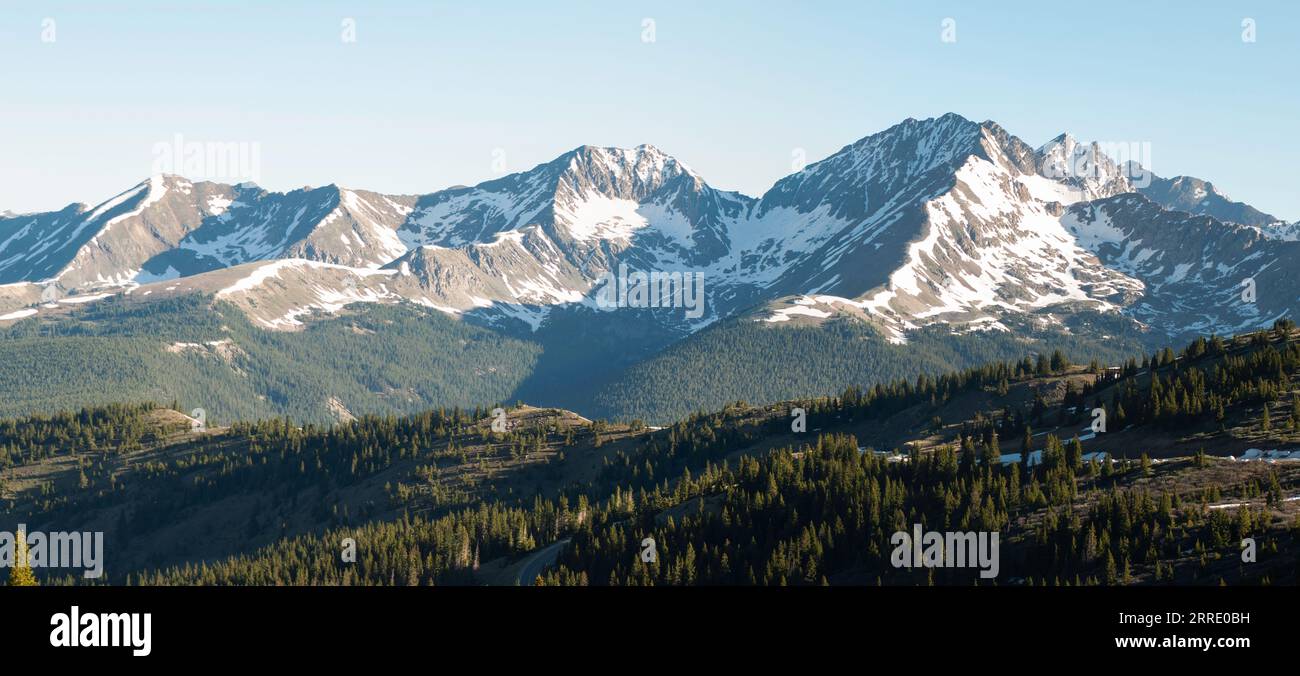 Lost in the grandeur of towering peaks, finding solace in the embrace ...