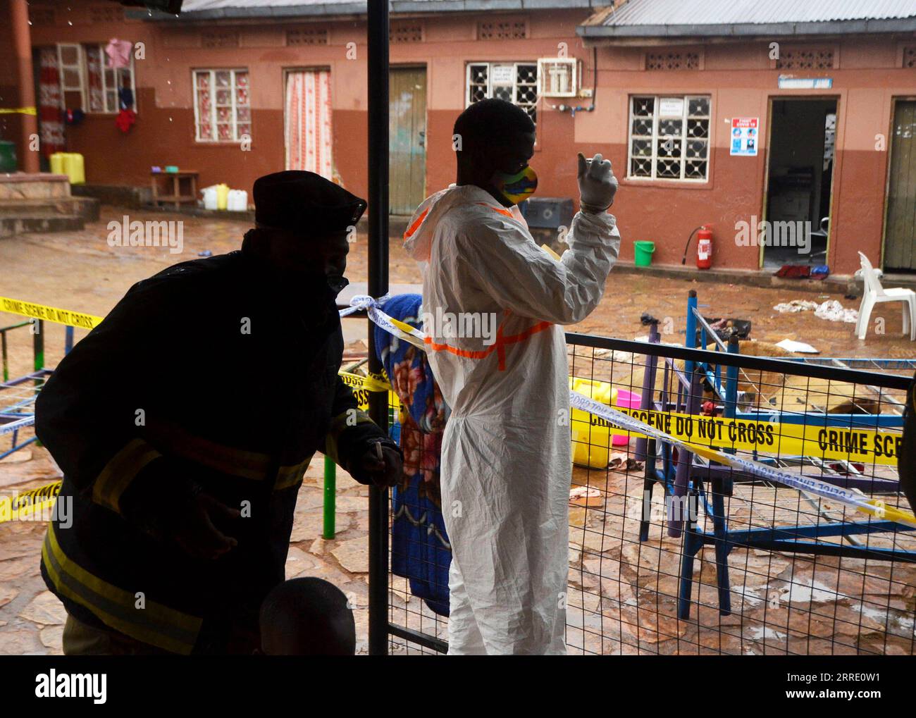 220117 -- KAMPALA, Jan. 17, 2022 -- A fire forensic expert is seen ...