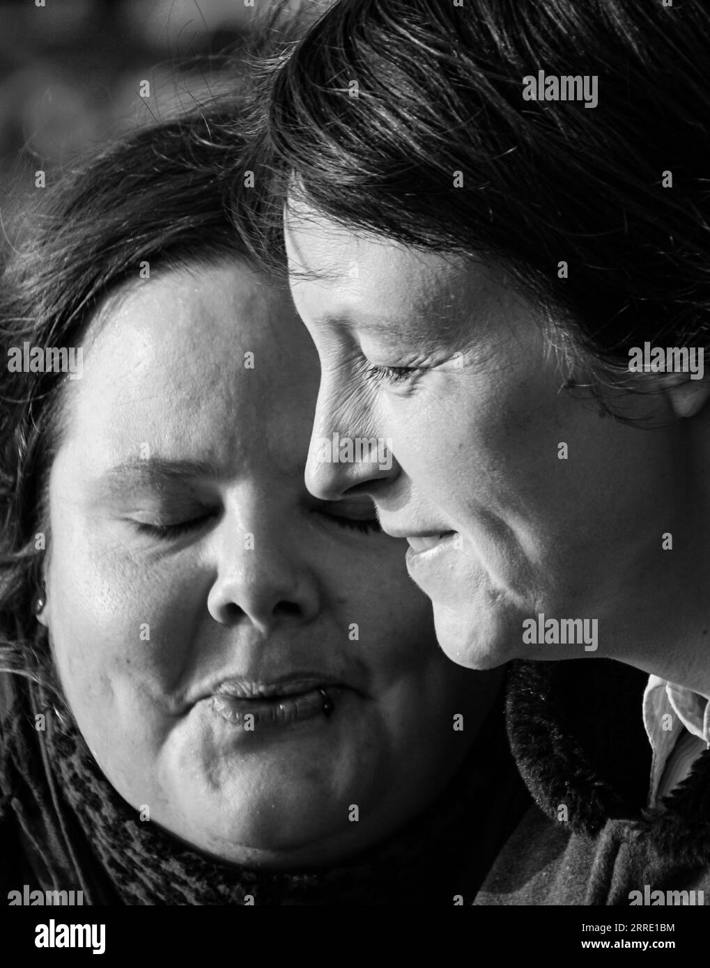 Close up portrait of two friends in black and white Stock Photo - Alamy