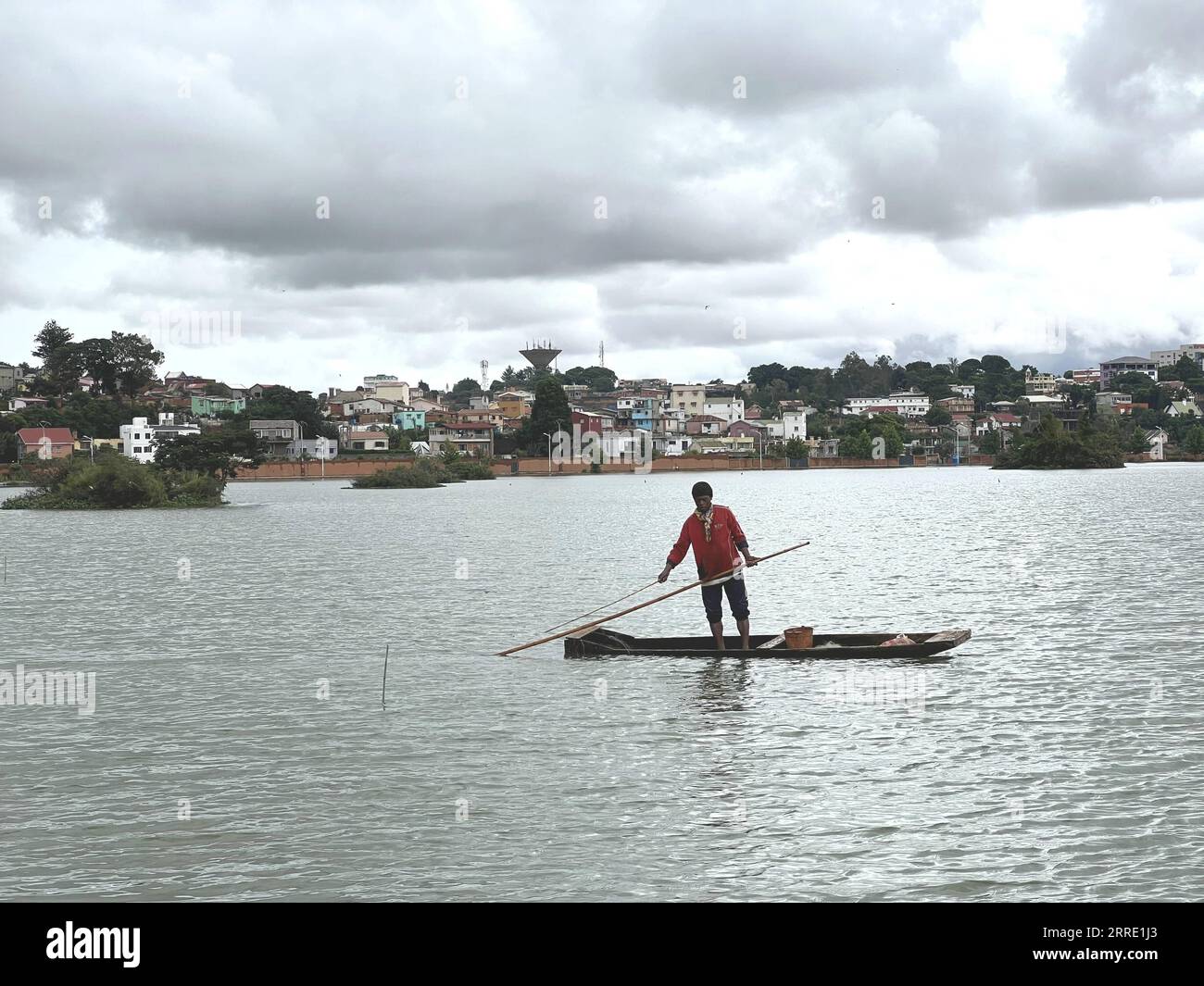 220119 -- ANTANANARIVO, Jan. 19, 2022 -- A man is seen on a canoe on ...