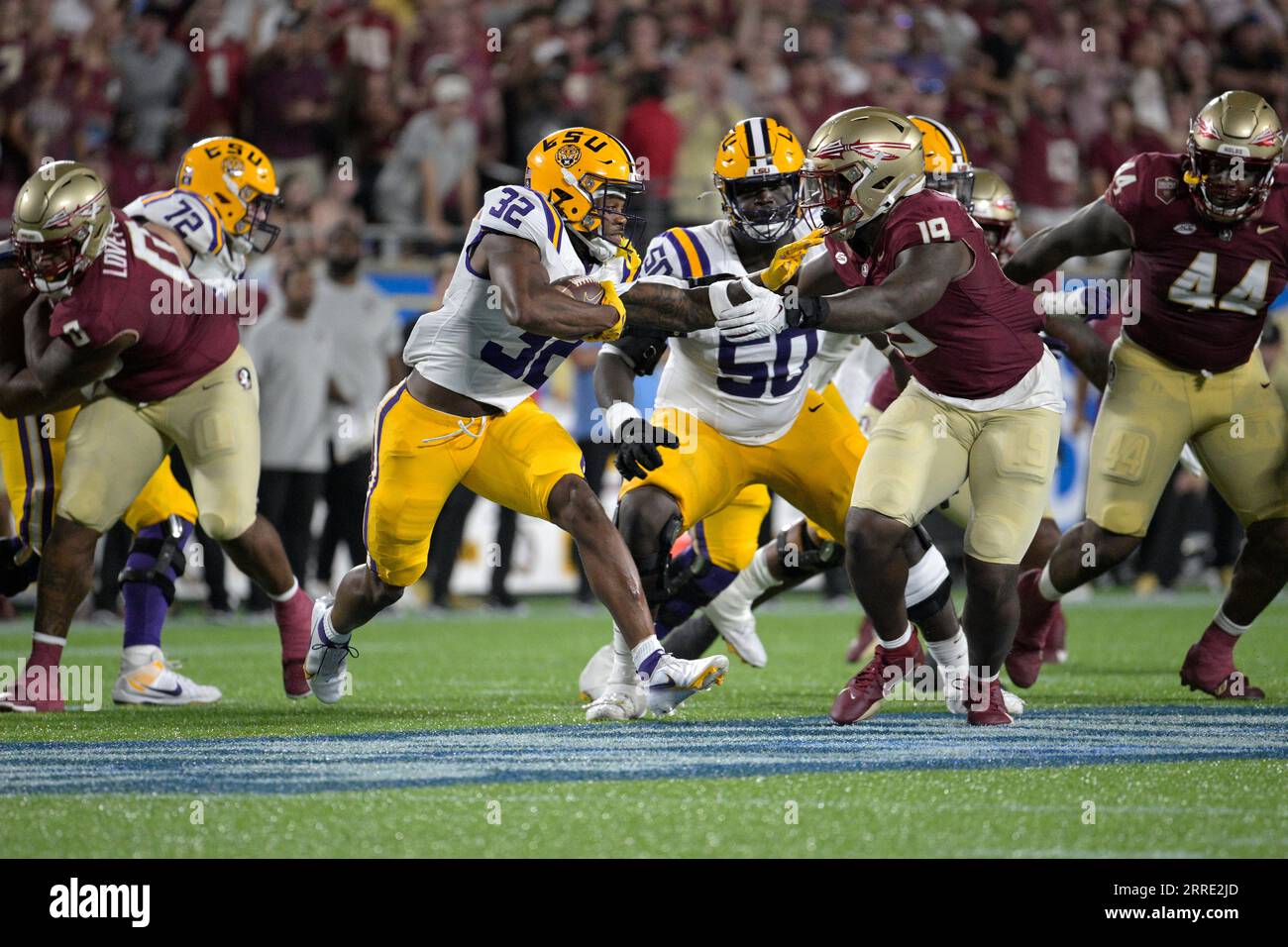 Florida State defensive lineman Gilber Edmond (19) tackles LSU running ...
