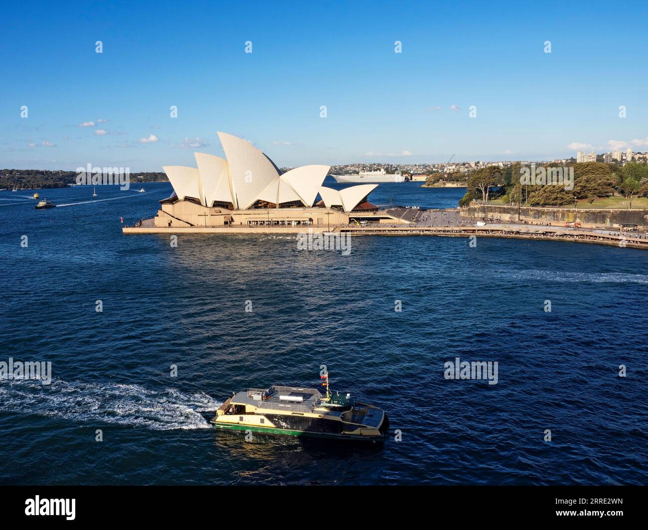 Sydney Australia / A Sydney commuter ferry passes the Sydney Opera House. The Ruby langford ...