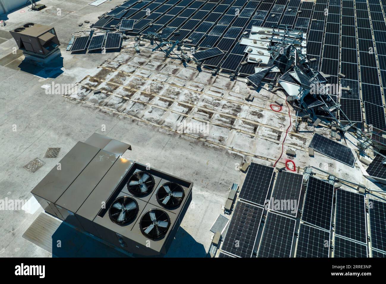 Aerial view of damaged by hurricane wind photovoltaic solar panels ...