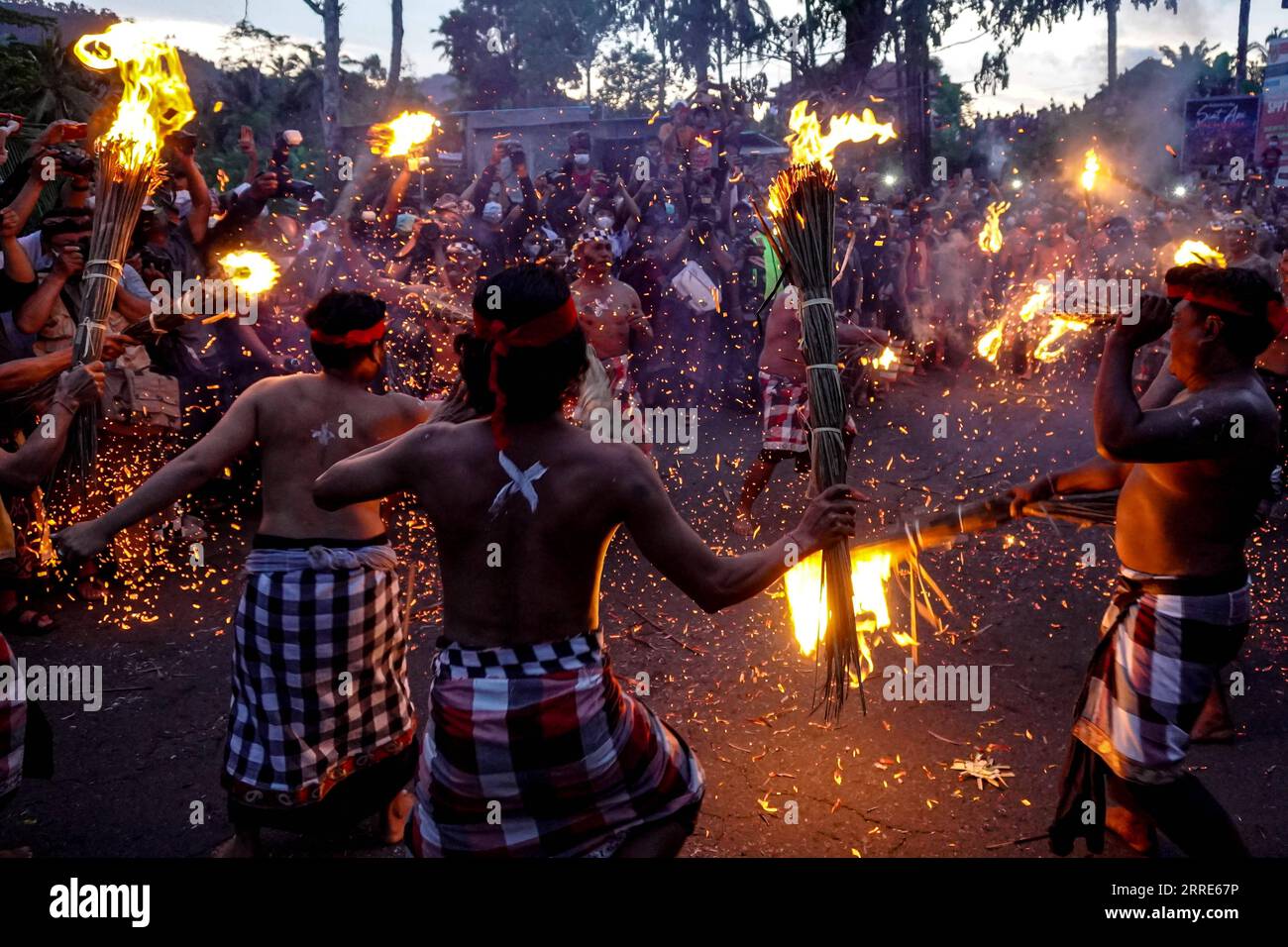 220131 -- BALI, Jan. 31, 2022 -- People participate in a fire war ...