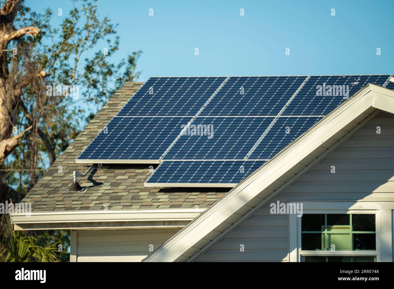 Private home roof covered with solar photovoltaic panels for generating ...