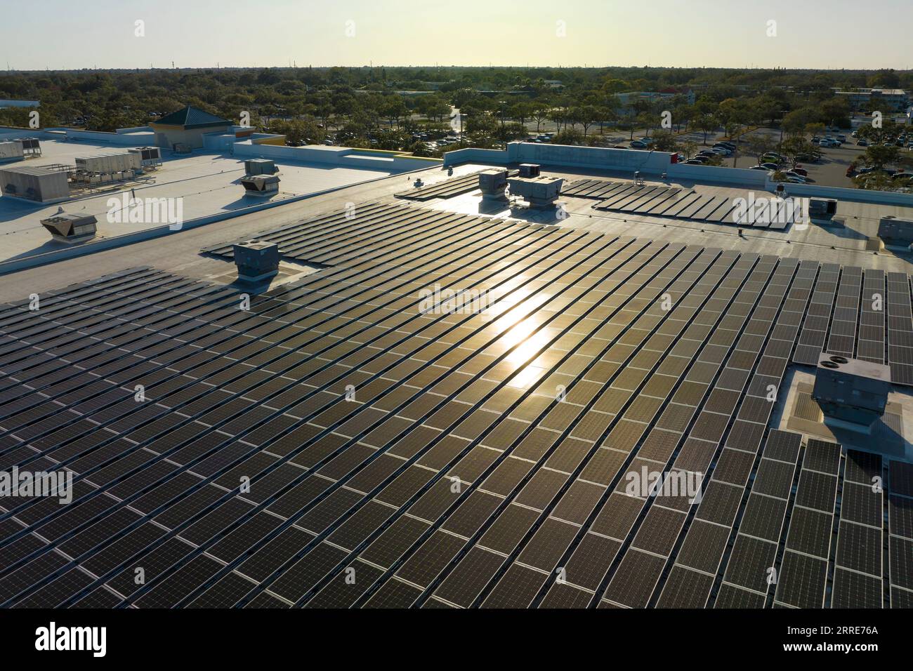 Photovoltaic solar panels mounted on industrial building roof for ...