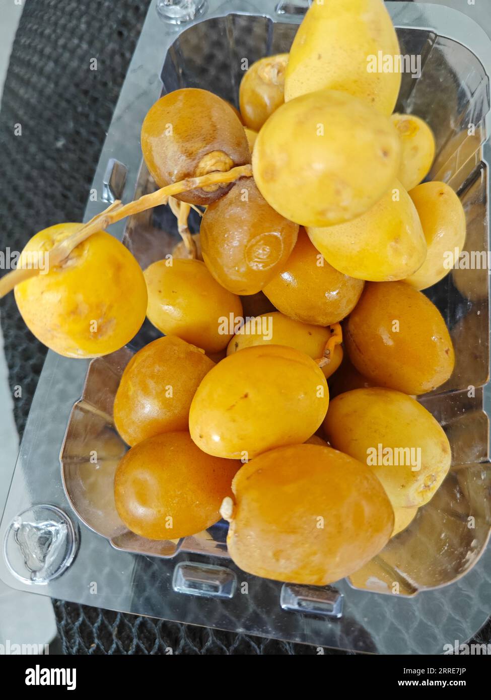 cluster of fresh ripe yellow date Stock Photo - Alamy