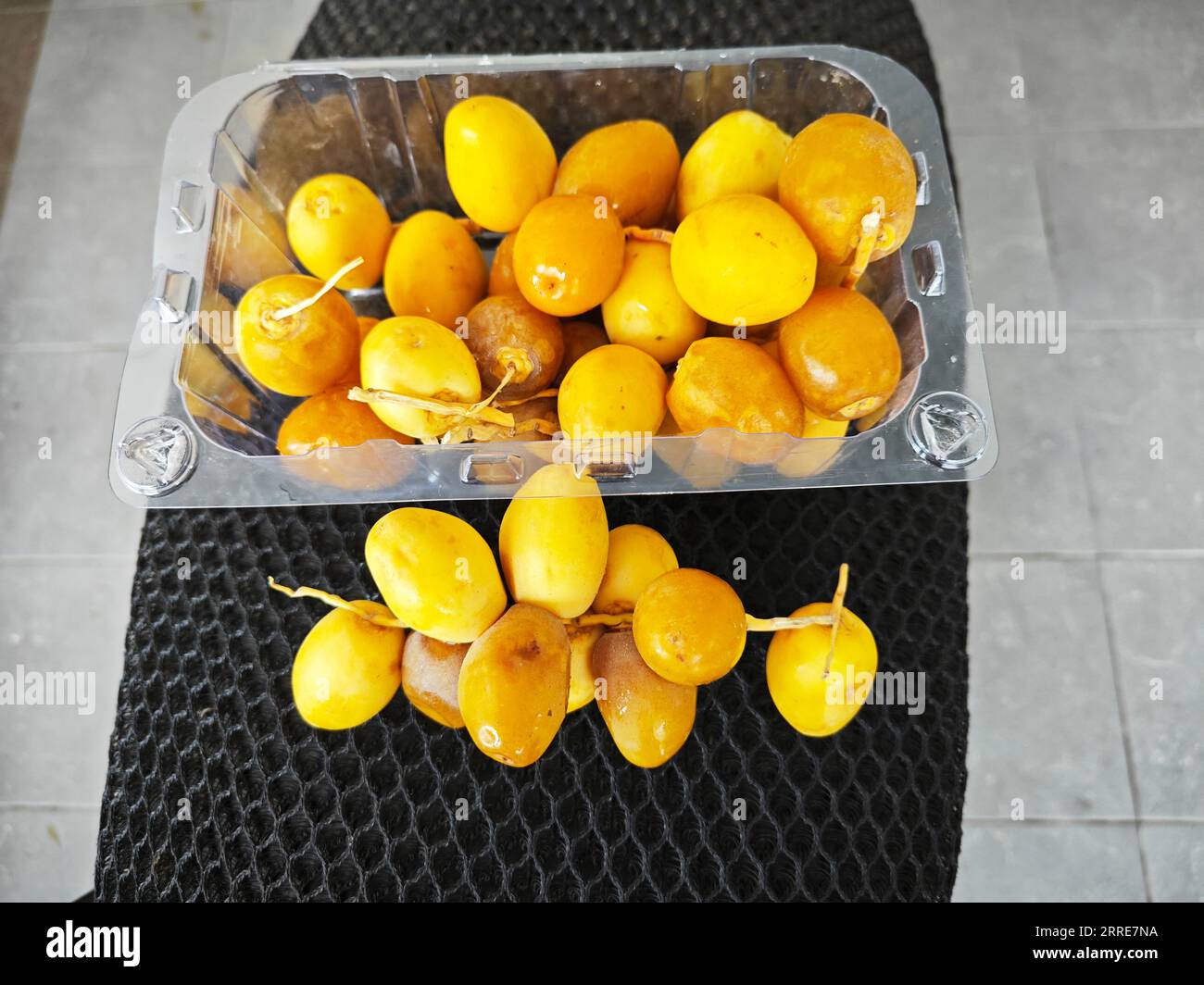 cluster of fresh ripe yellow date Stock Photo - Alamy