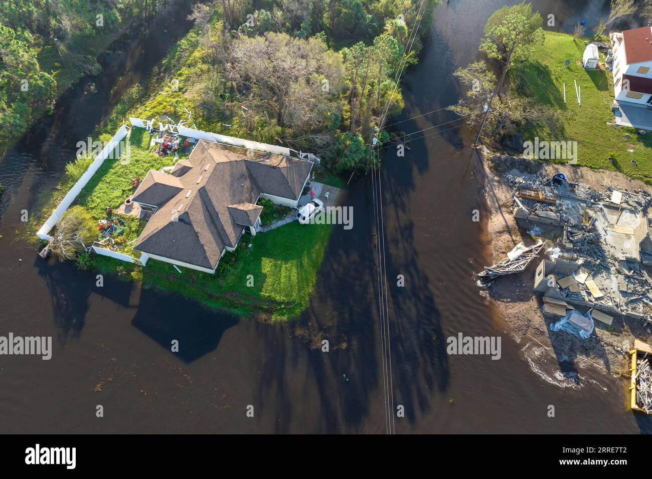 Surrounded by hurricane rainfall flood waters homes in Florida ...