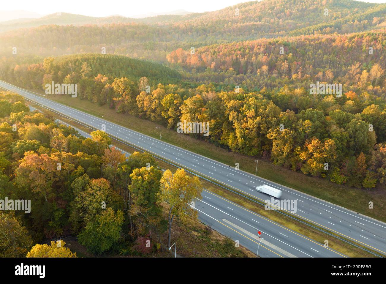 View from above of busy american highway with fast moving trucks and ...