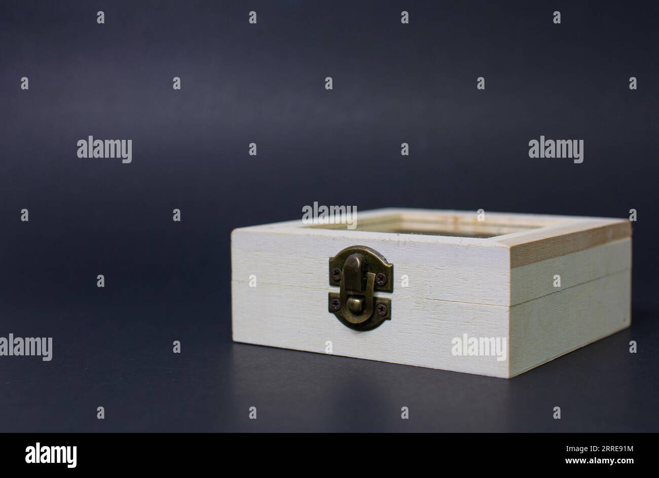 Empty small light brown wooden box Container objects are locked with ...