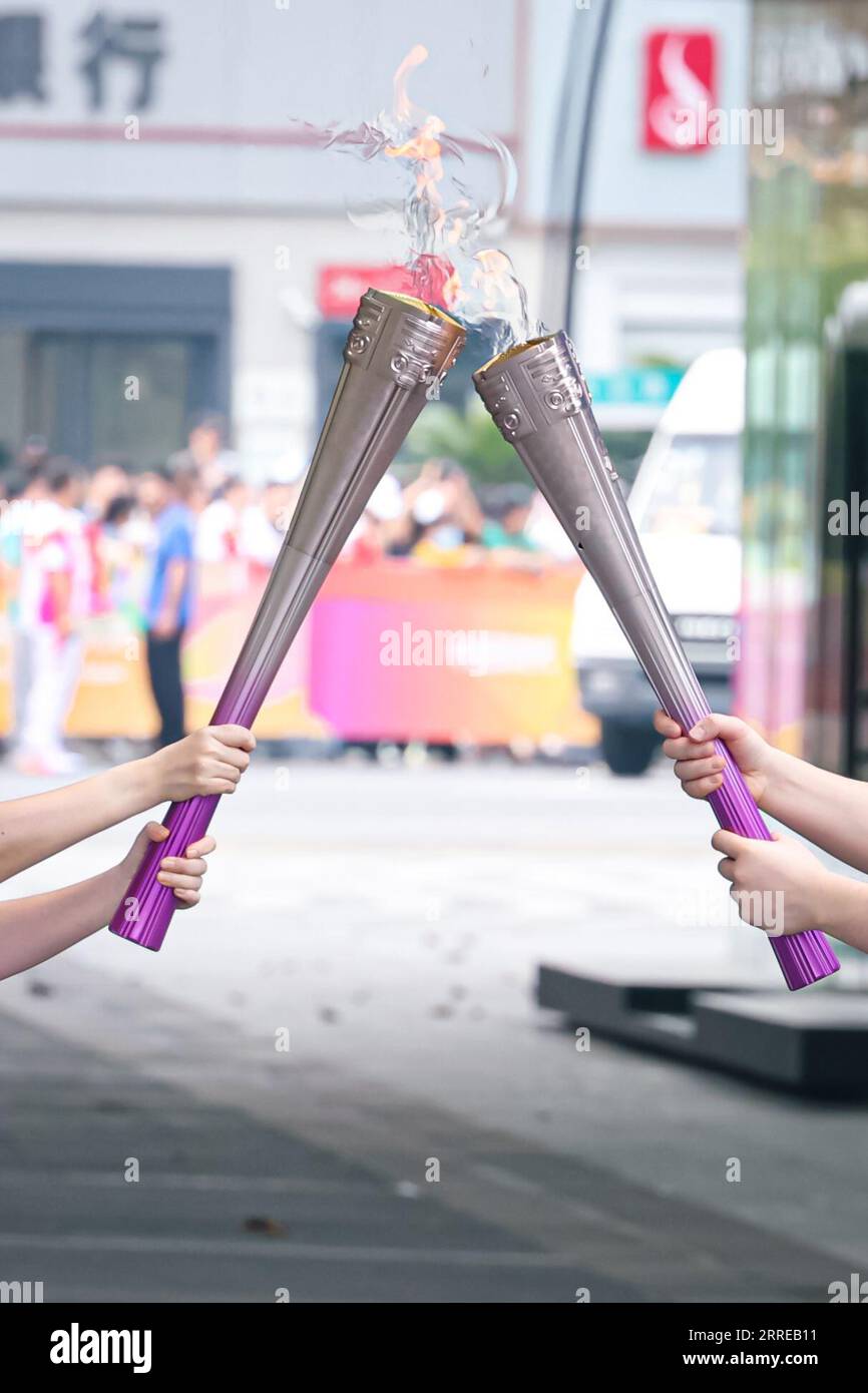 Hangzhou, China's Zhejiang Province. 8th Sep, 2023. Torch bearers pass ...