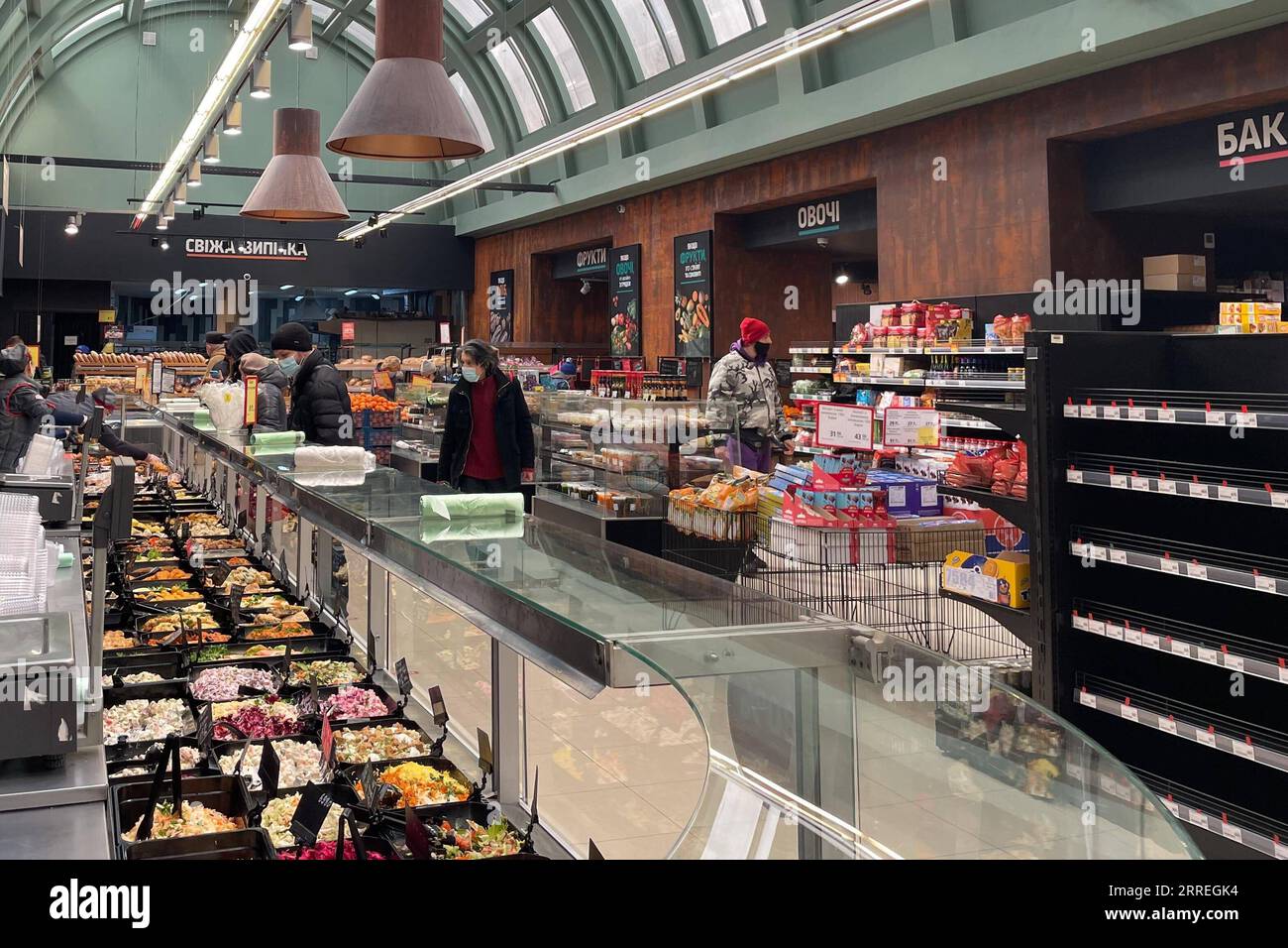 220301 -- LVIV, March 1, 2022 -- People go shopping at a supermarket in ...